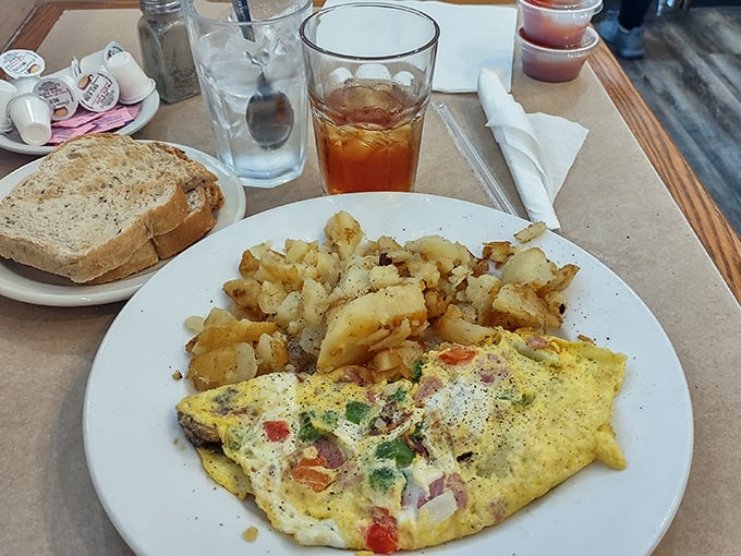 Breakfast perfection on a plate: A colorful omelet alongside potatoes that achieved the holy grail &ndash; crispy exterior, fluffy interior.