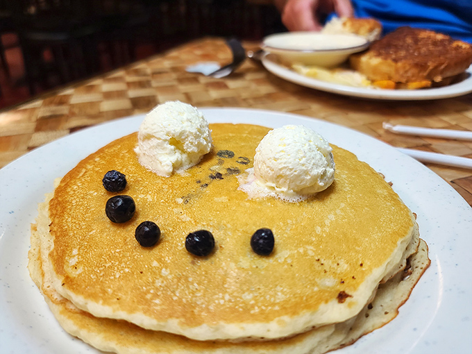 Golden pancakes with a perfect smiley face of blueberries and dollops of butter &ndash; breakfast doesn't get more cheerful than this edible emoji.