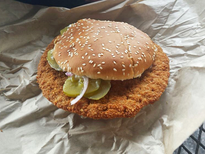 The legendary pork tenderloin in all its golden-fried glory. The bun seems to be playing a supporting role in this production.