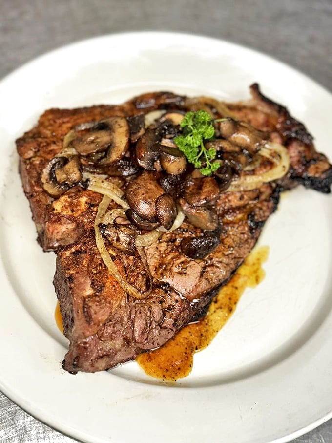 A ribeye topped with saut&eacute;ed mushrooms and onions that will haunt your dreams. This isn't just dinner&mdash;it's a religious experience with a perfectly caramelized crust.