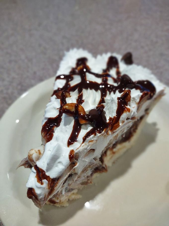 Possum Pie in all its glory&mdash;layers of decadence topped with whipped cream and chocolate drizzle. No marsupials were harmed in the making.