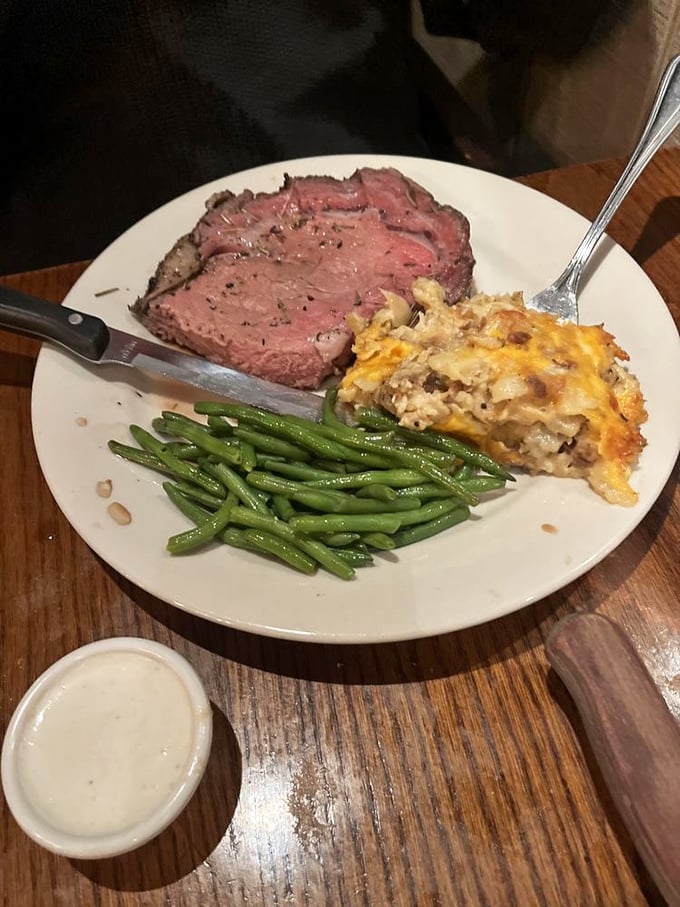 What prime rib should look like in your dreams: perfectly pink, alongside a potato casserole that could make Idaho weep with pride.