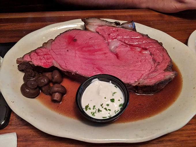 This isn't just prime rib; it's a masterpiece of meat &ndash; perfectly pink, surrounded by savory jus, with mushrooms and horseradish cream standing by for backup.