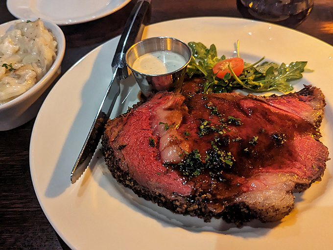 This prime rib isn't just cooked—it's been coaxed to perfection, with that telltale pink center that whispers, "Yes, they know exactly what they're doing."