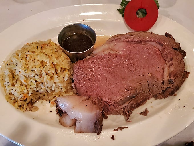 Prime rib that's more relaxed than I am on vacation. This rosy masterpiece with rice pilaf is what carnivorous dreams are made of.