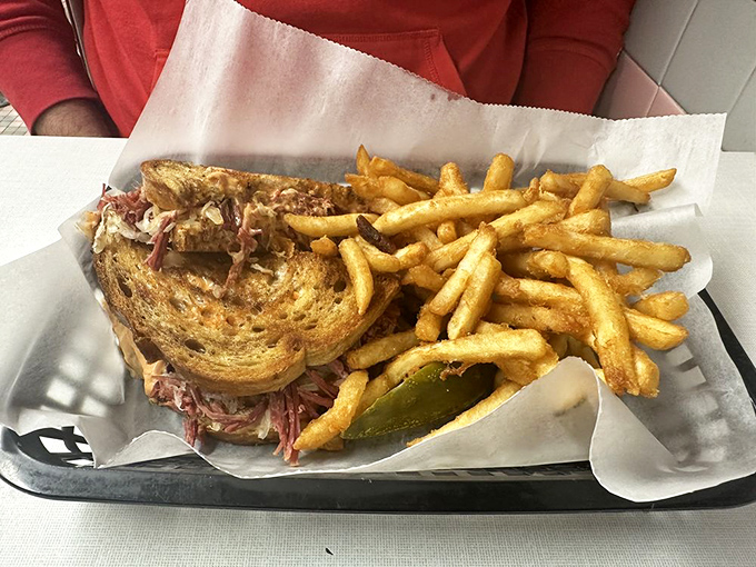 That perfect Reuben moment: when the marble rye is toasted just right, the corned beef is still steaming, and the fries are calling your name.