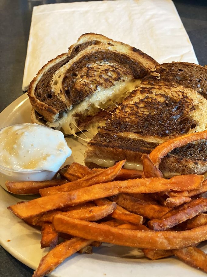 Behold: sandwich perfection meets sweet potato fries. That cheese pull isn't just photogenic&mdash;it's a siren call to sandwich lovers everywhere.