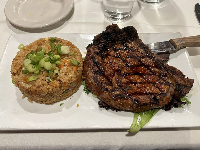 This isn't just a ribeye&mdash;it's a carnivore's sonnet with perfectly seasoned rice. The grill marks alone deserve their own Instagram account.