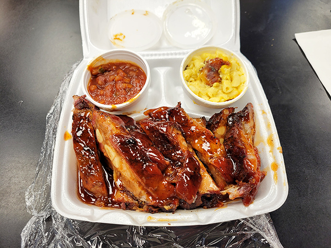 Glistening ribs lounging in sauce next to mac and cheese that didn't come from a box. This styrofoam container might as well be fine china.