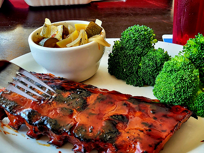 Behold: ribs with a smoke ring so perfect it could make a pitmaster weep, accompanied by vegetables pretending anyone's paying attention to them.