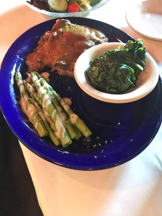 This pot roast isn't just tender&mdash;it's having an existential crisis about its own deliciousness. The asparagus and greens provide thoughtful balance.