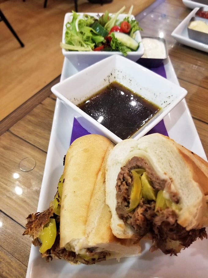 The French dip reimagined: tender roast beef, tangy peppers, and that au jus&mdash;oh, that au jus!&mdash;deep enough to baptize your taste buds.