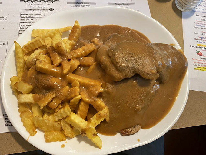 Behold the star of the show: roast beef swimming in gravy alongside golden fries. This isn't just a meal; it's therapy on a plate.