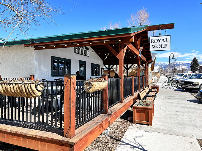 The Royal Wolf's patio practically begs you to extend your "one quick beer" into a full afternoon affair. Those mountains in the distance? Your dinner entertainment.