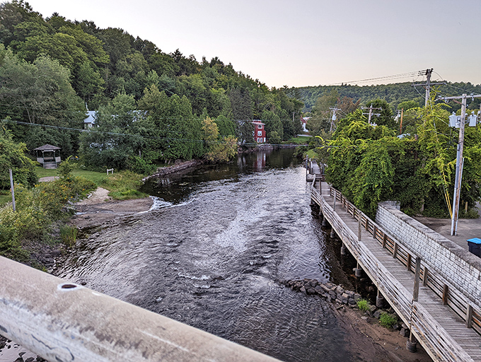The Saranac River doesn't just flow through town&mdash;it flows through the community's identity, connecting past and present like a liquid timeline.
