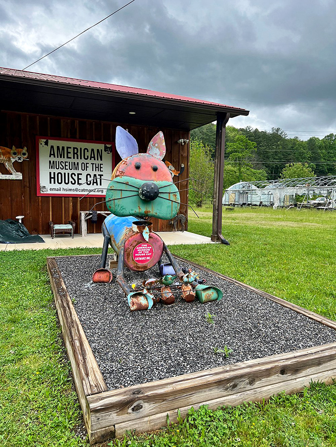 This colorful folk art cat sculpture guards the museum entrance like a feline sphinx, its mismatched materials telling stories of creative reuse.