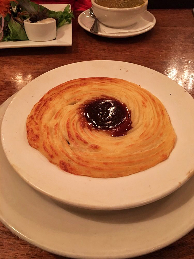 Behold the shepherd's pie in all its golden-topped glory, with that perfect crater of gravy in the center&mdash;like a delicious volcano waiting to erupt with flavor. 