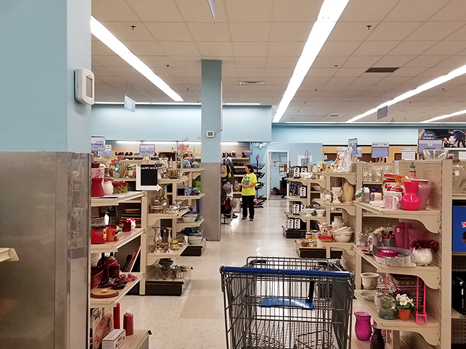 Mattresses and bedroom sets await new homes, arranged in displays that make you wonder who might have dreamed beneath these headboards before.