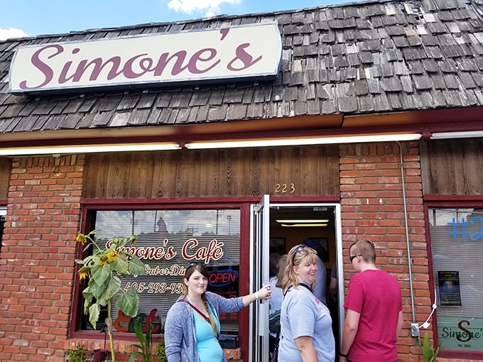 Simone's Cafe welcomes visitors with the universal language of homestyle cooking. That screen door sound? Pure Americana with a side of pie.
