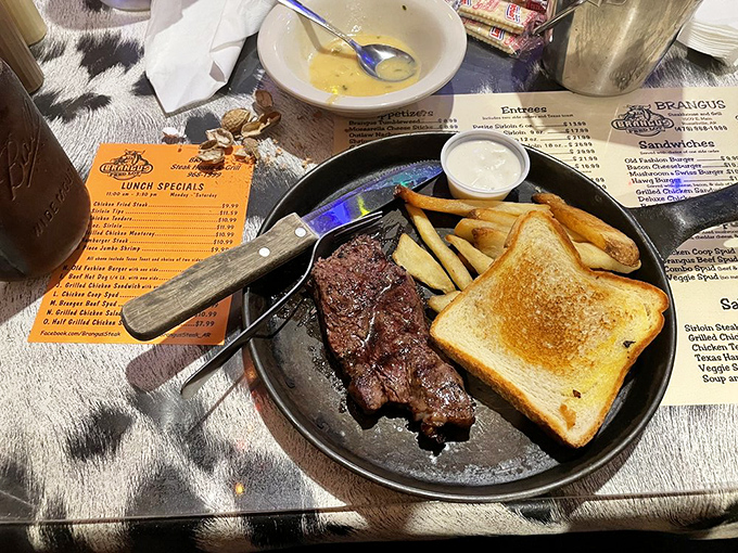 This sirloin doesn't just sit on the plate—it commands attention with its perfect sear and sides that know their supporting role.