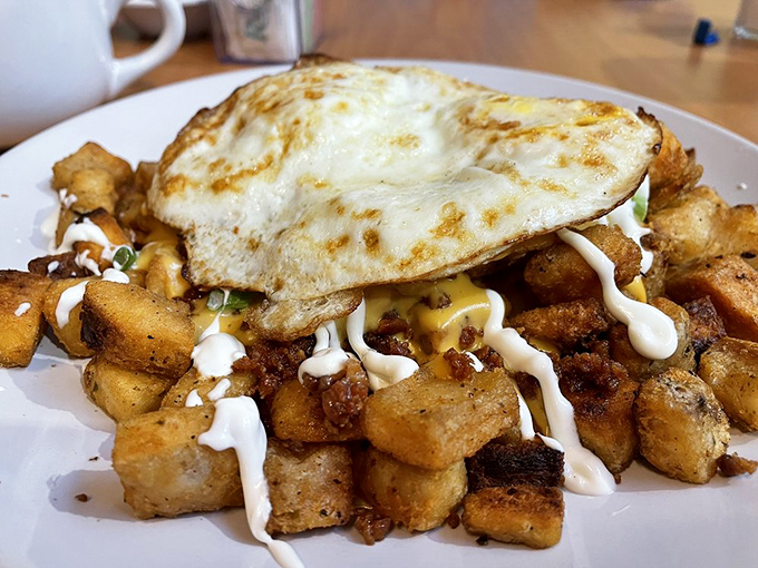 This omelet doesn't just contain bacon&mdash;it embraces it like a long-lost friend, with home fries standing by as willing accomplices.