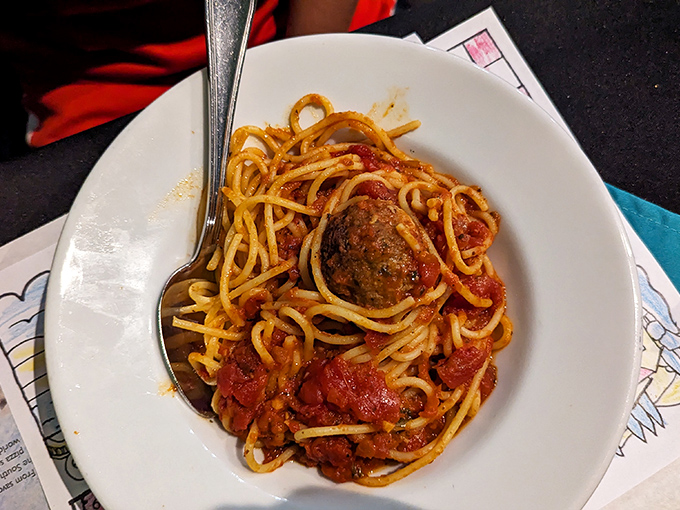 Spaghetti and meatball perfection: tender pasta swimming in robust sauce with a meatball that could star in its own food documentary.