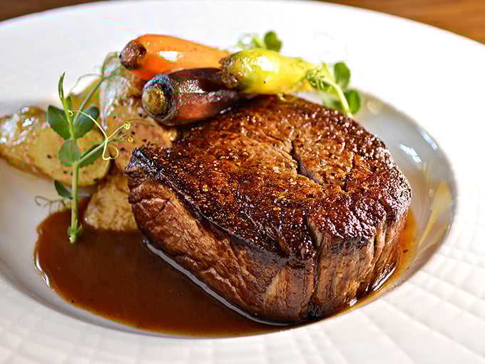 The dining room at Lied Lodge marries rustic elegance with Nebraska hospitality. Those timber beams have witnessed countless "mmms" of satisfaction. 