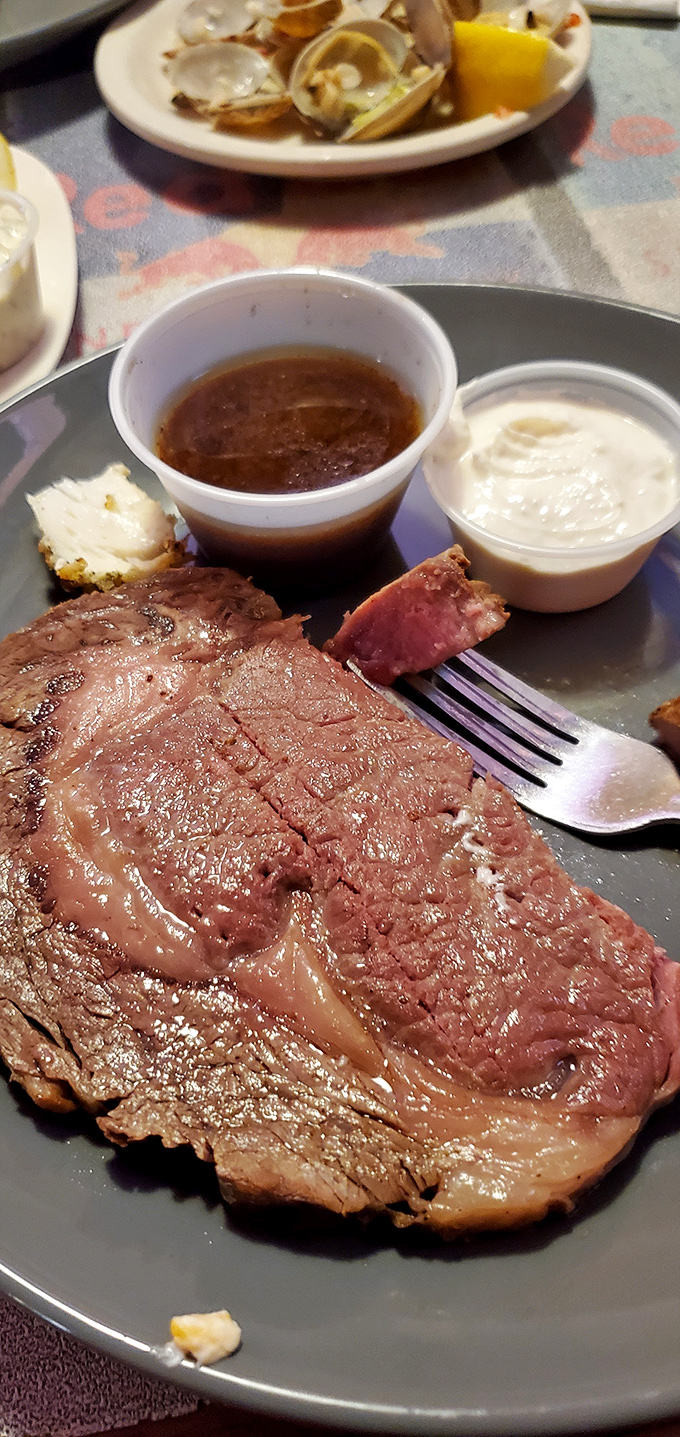 A perfectly grilled steak alongside rice pilaf&mdash;proof that simplicity executed flawlessly beats complexity every time. That knife isn't just a utensil, it's an invitation. 