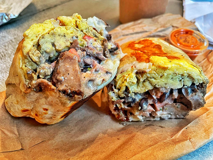This breakfast burrito showcases the art of balance - perfectly scrambled eggs, savory steak, and bright chimichurri creating a morning masterpiece.