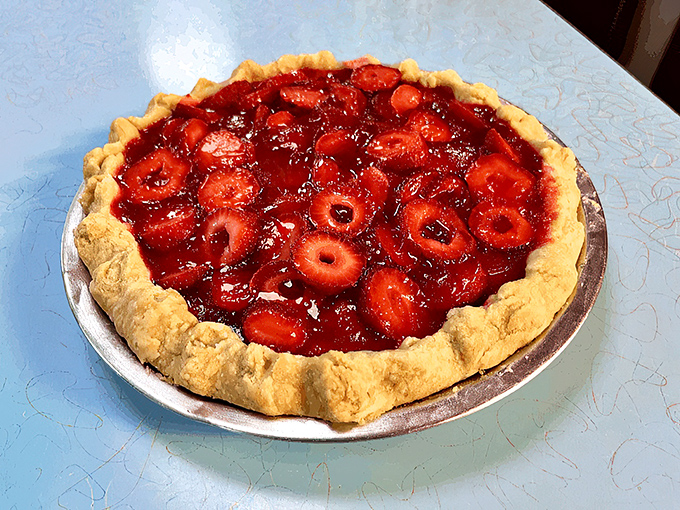 This strawberry pie isn't trying to be fancy; it's trying to be remembered. Judging by that glistening ruby filling, mission accomplished.