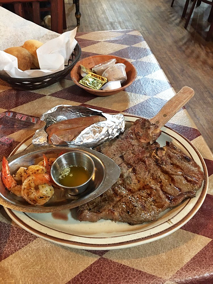 This T-bone with shrimp sidekick isn't just dinner&mdash;it's a declaration of principles. Notice how the steak knife stands at attention, ready for its important duty.