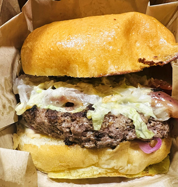 Behold the burger in its natural habitat: juicy, perfectly cooked, and nestled in a golden bun. This isn't fast food&mdash;it's slow food done quickly.