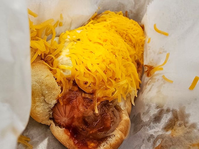 The Tommy Dog doesn't just satisfy hunger&mdash;it obliterates it with a mountain of cheese cascading over chili like a delicious yellow avalanche.