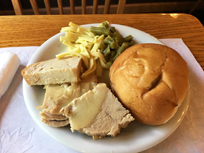 Turkey so tender it practically surrenders to your fork, served with noodles that would make any grandmother nod in approval.