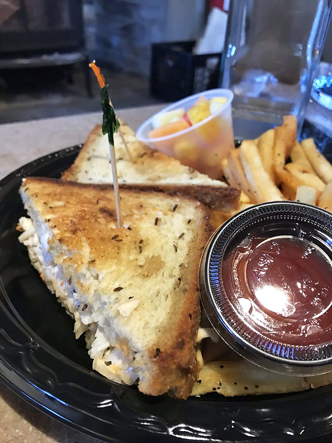 A sandwich artist's masterpiece: perfectly toasted bread embracing layers of savory ham and melted cheese &ndash; proof that simplicity, when done right, is the ultimate luxury.