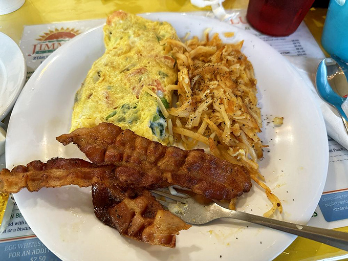 A perfectly executed omelet that proves simple ingredients in the right hands can create magic. Those home fries deserve their own fan club.