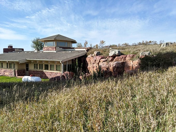 Prairie meets architecture at the visitor center, where quartzite building materials echo the surrounding cliffs. Nature's design influence at its finest.