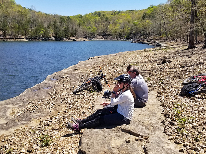 Taking a breather where the bikes rest and the lake stretches out like nature's welcome mat. Some views are worth every pedal stroke.