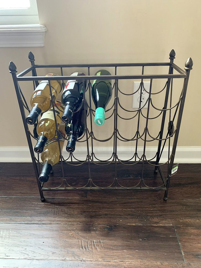This elegant wine rack waits patiently for its forever home. Someone's dinner parties are about to get a serious upgrade for pennies on the dollar. 