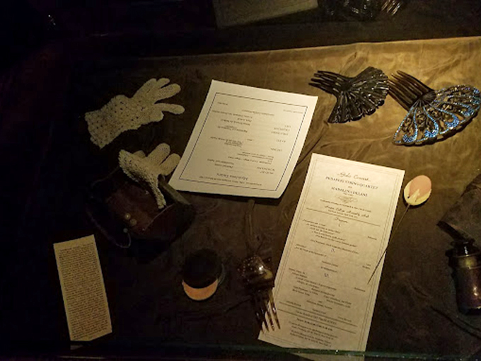 Artifacts arranged with meticulous precision invite closer inspection. Is that a pair of antique gloves or evidence of something more mysterious?
