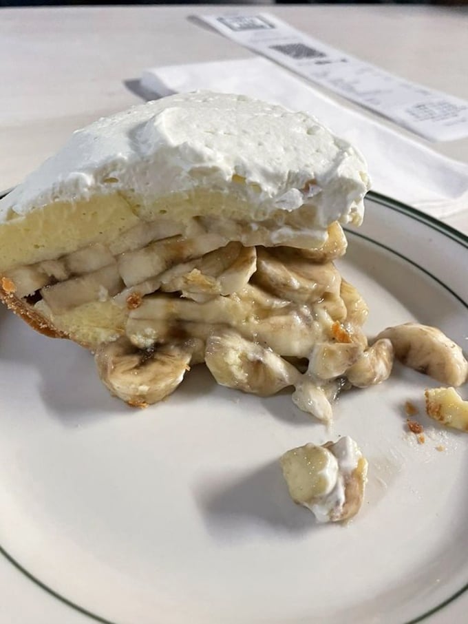 This isn't just banana cream pie &ndash; it's edible poetry. Layers of custard, fresh bananas, and whipped cream that would make your grandmother simultaneously proud and jealous.