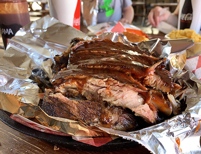 Behold the brisket in all its glory! Those glistening slices with their perfect pink smoke ring are what barbecue dreams are made of.