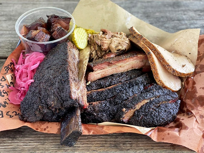 BBQ perfection doesn't need fancy plating. This tray of blackened brisket, ribs, and pulled pork is North Carolina's answer to the Sistine Chapel.