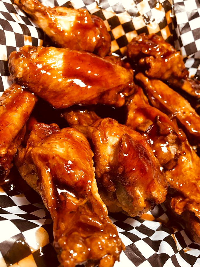 These buffalo wings aren't just saucy, they're downright provocative – glistening with that perfect balance of heat and sweet that haunts your dreams.