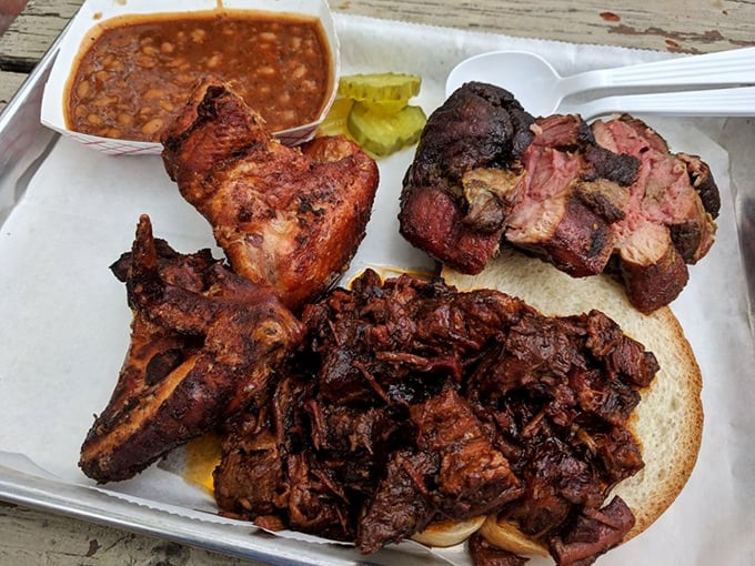 Meat candy for grown-ups! This tray of smoky delights showcases Woodyard's commitment to barbecue perfection. That bark has more character than most Hollywood scripts.