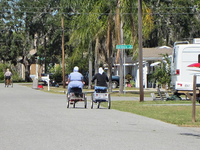 The Amish version of a Ferrari: two residents pedal down Graber Avenue, showcasing the community's commitment to simple transportation and neighborly pace.