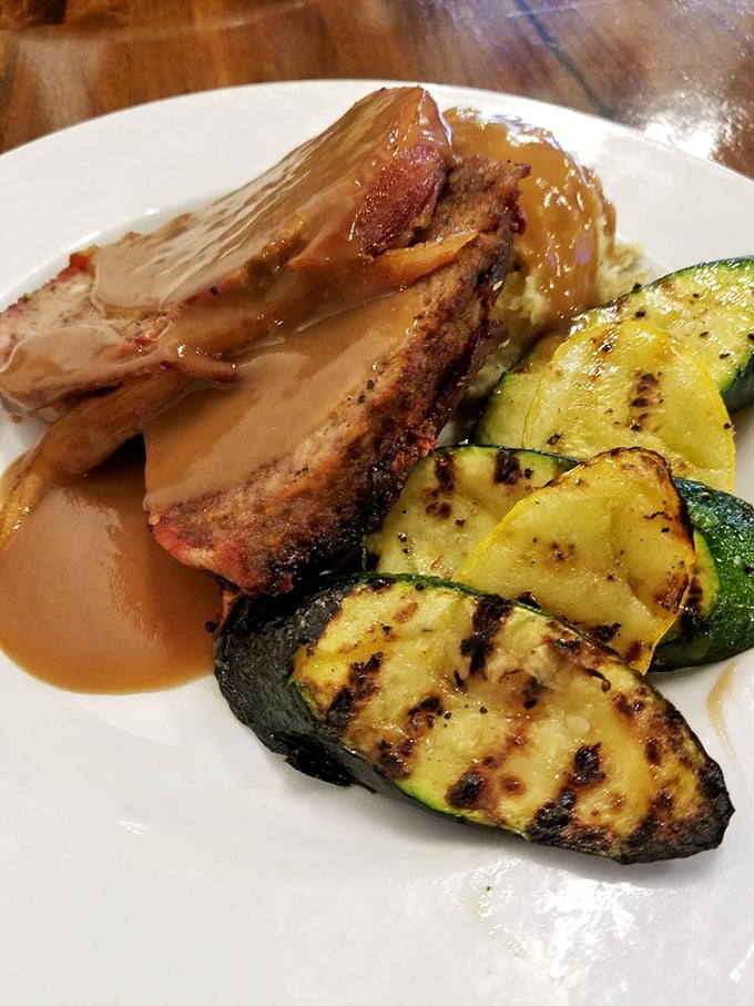 Behold the meatloaf that launches road trips! Perfectly seared, gloriously sauced, and paired with grilled zucchini that actually makes vegetables exciting again.