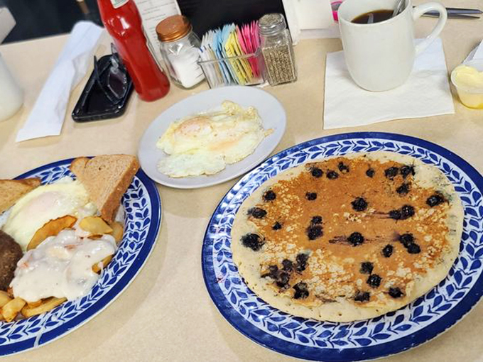 These blueberry pancakes aren't just breakfast, they're edible sunshine. The berries burst with flavor that could brighten even the foggiest mountain morning. 