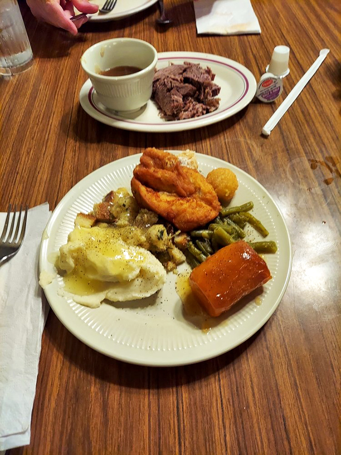 A plate that tells the whole story&mdash;golden fried chicken, buttery mashed potatoes, and vegetables that haven't forgotten their connection to actual farms. Comfort food nirvana achieved.