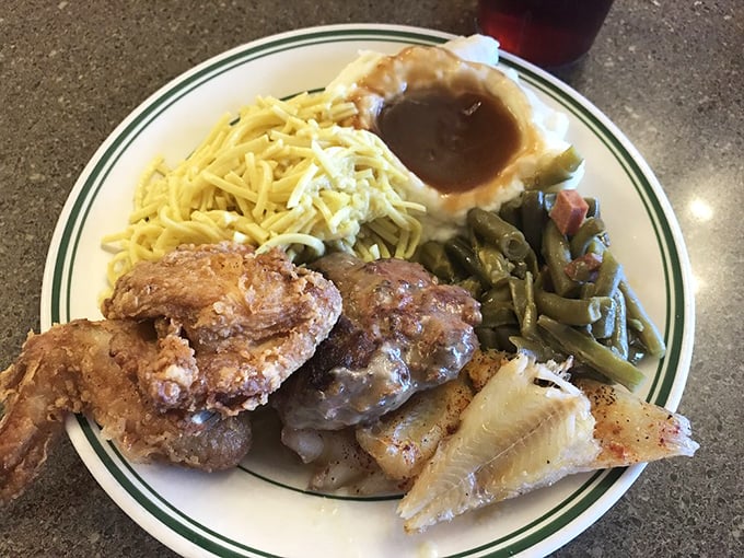 A plate that tells the true Hoosier story: golden fried delights alongside farm-fresh sides, all waiting to comfort your soul.
